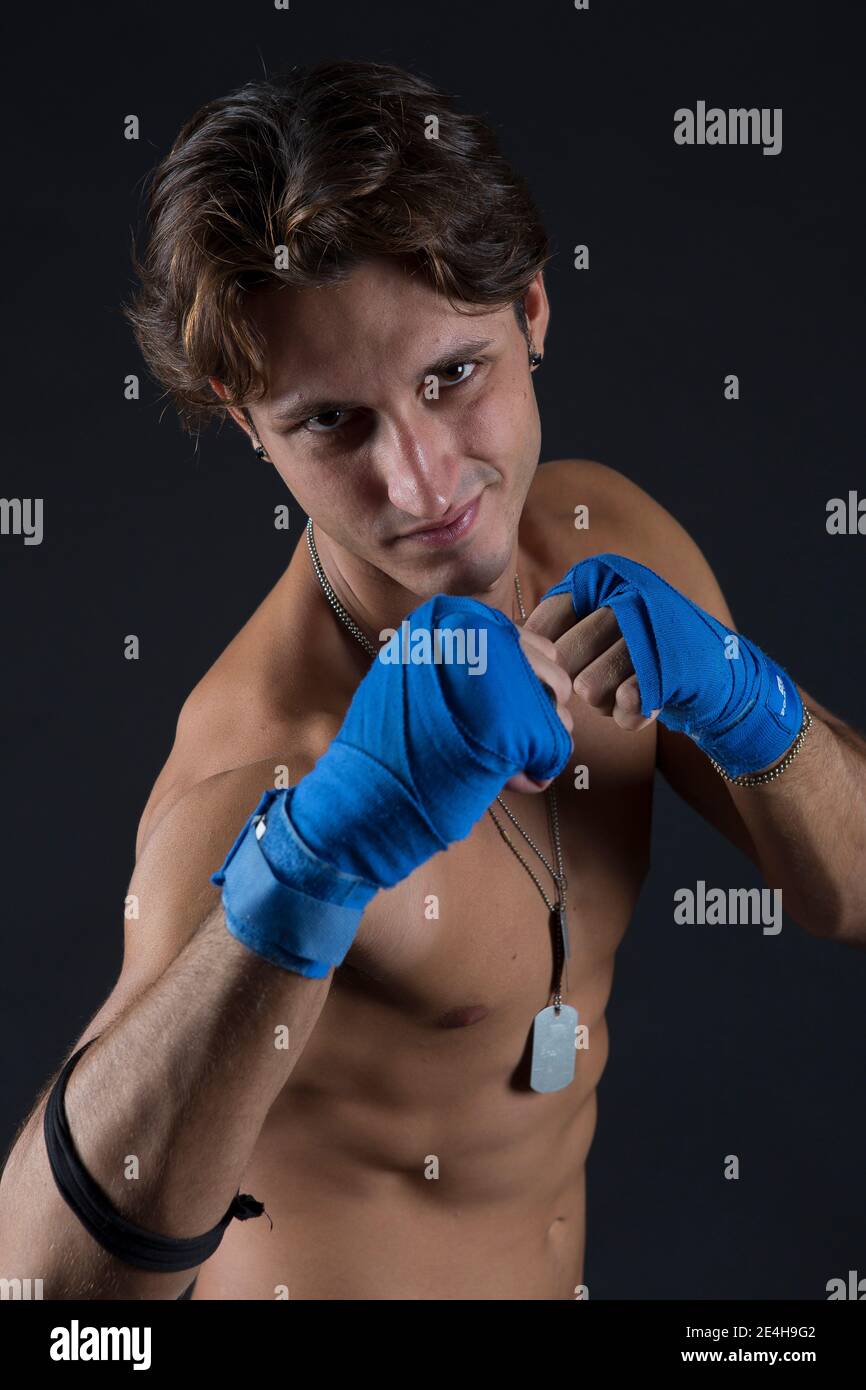 Studio portrait of a muscular built italian young man Stock Photo - Alamy