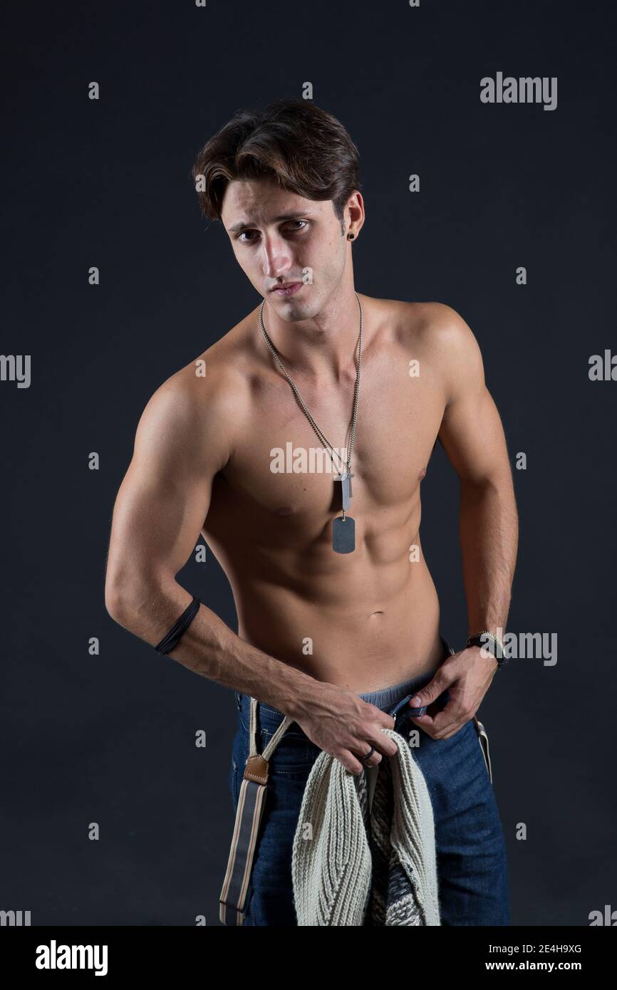 Studio portrait of a muscular built italian young man Stock Photo - Alamy