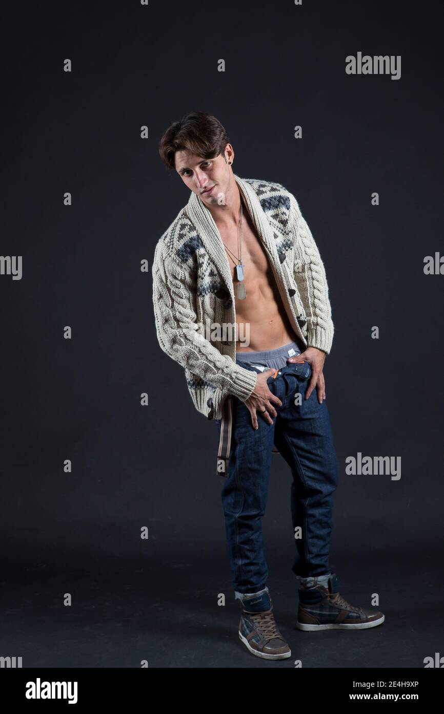 Studio portrait of a muscular built italian young man Stock Photo - Alamy