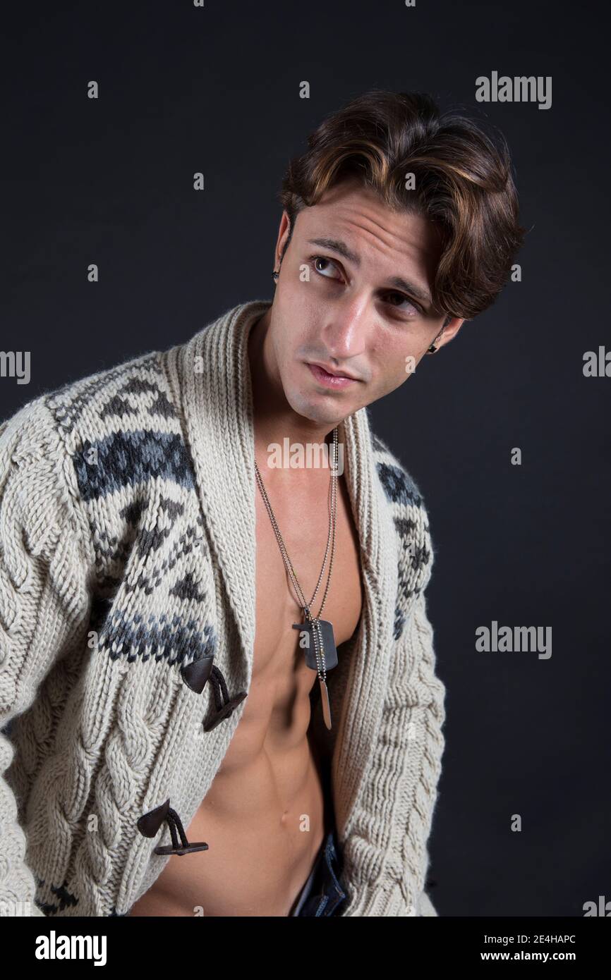 Studio portrait of a muscular built italian young man Stock Photo - Alamy
