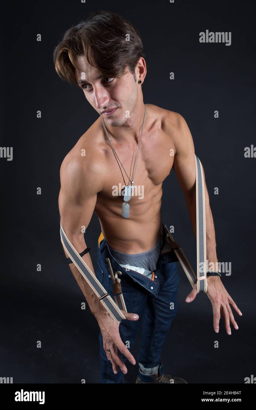 Studio portrait of a muscular built italian young man Stock Photo - Alamy