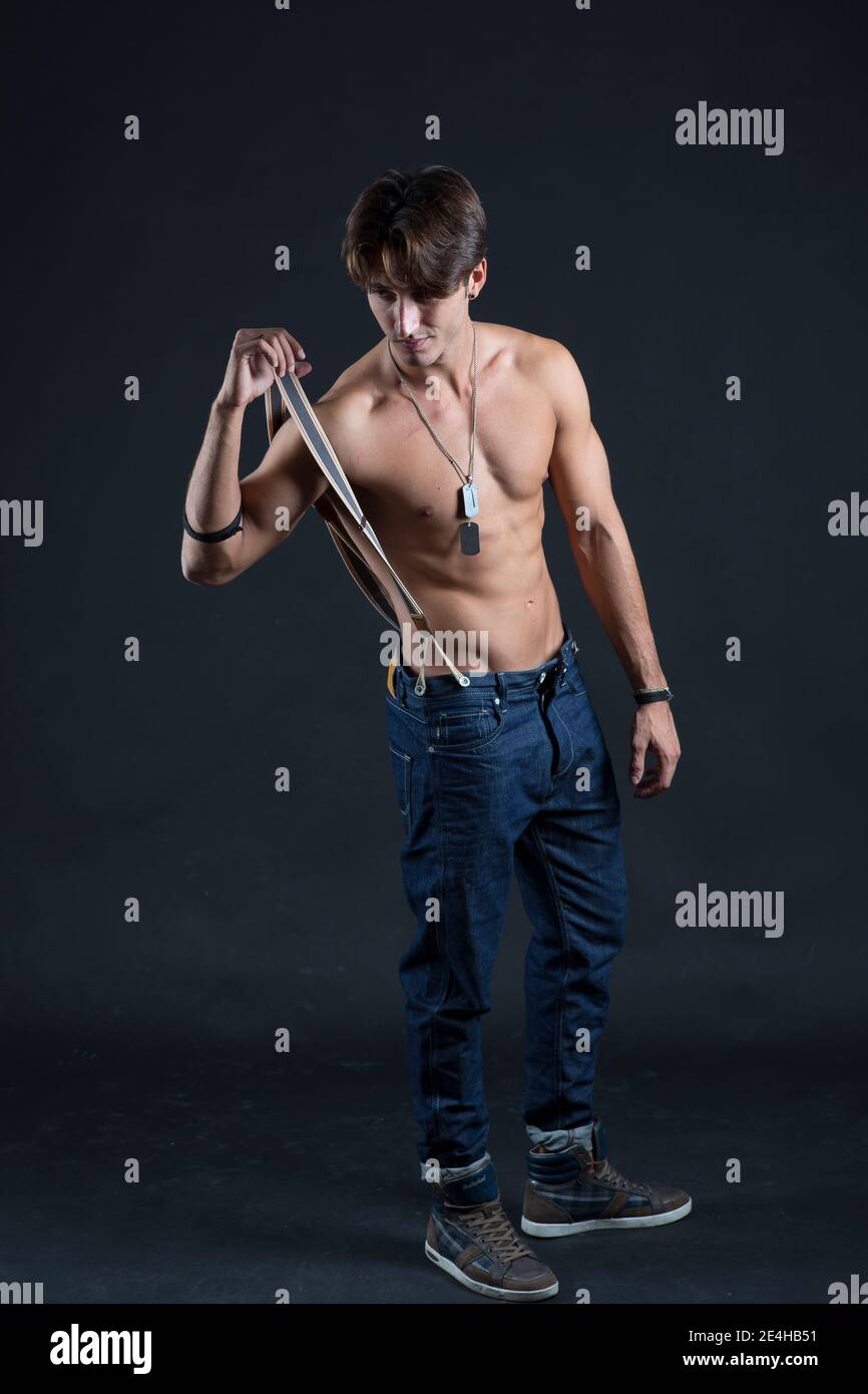 Studio portrait of a muscular built italian young man Stock Photo - Alamy