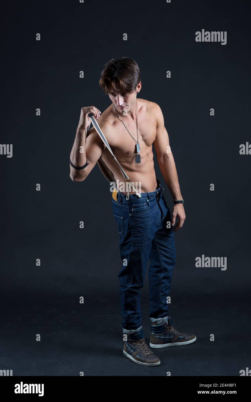 Studio portrait of a muscular built italian young man Stock Photo - Alamy