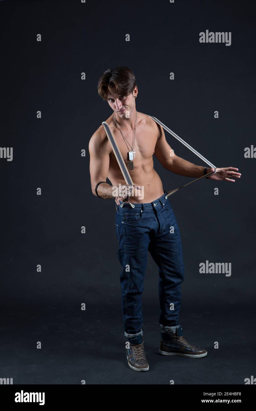 Studio portrait of a muscular built italian young man Stock Photo - Alamy