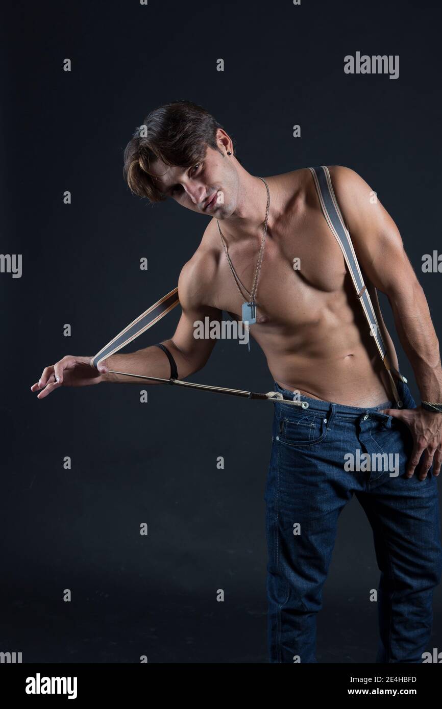 Studio portrait of a muscular built italian young man Stock Photo - Alamy
