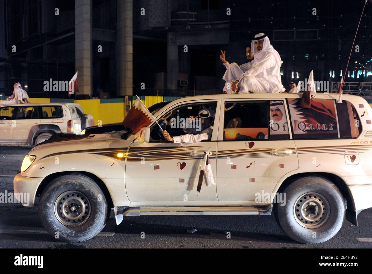 Qatari people decorate their 4-wheel-drive cars with hearts, flags ...