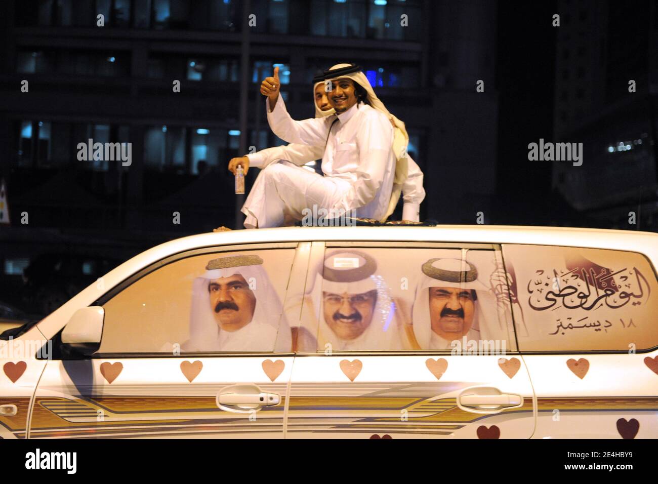 Qatari people decorate their 4-wheel-drive cars with hearts, flags ...