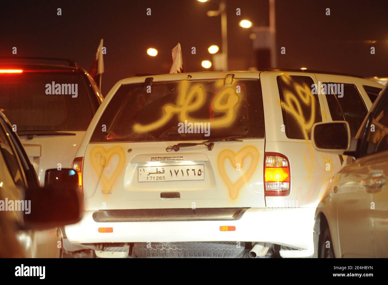Qatari people decorate their 4-wheel-drive cars with hearts, flag, and ...
