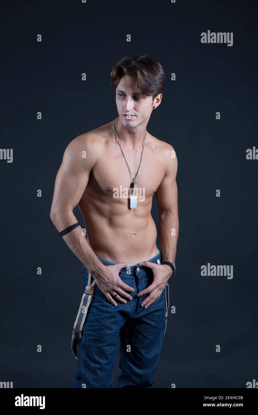 Studio portrait of a muscular built italian young man Stock Photo - Alamy