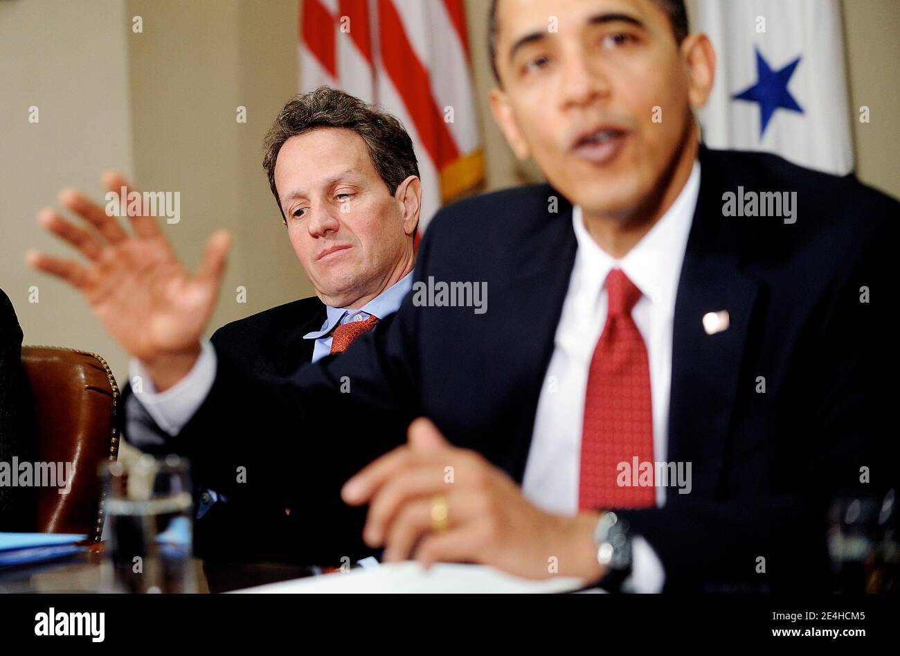 Looks on as us treasury secretary tim geithner hi-res stock photography ...