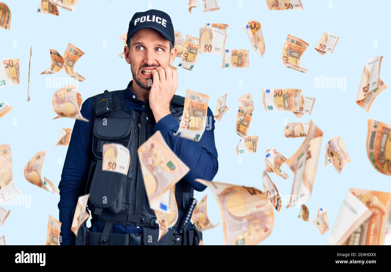 Young handsome man wearing police uniform looking stressed and nervous ...