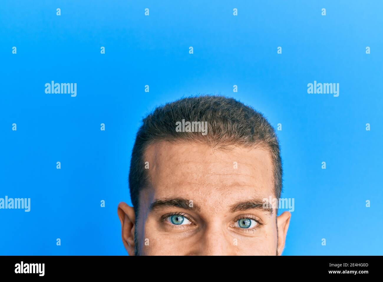 Young caucasian man showing head and half face smiling and laughing ...