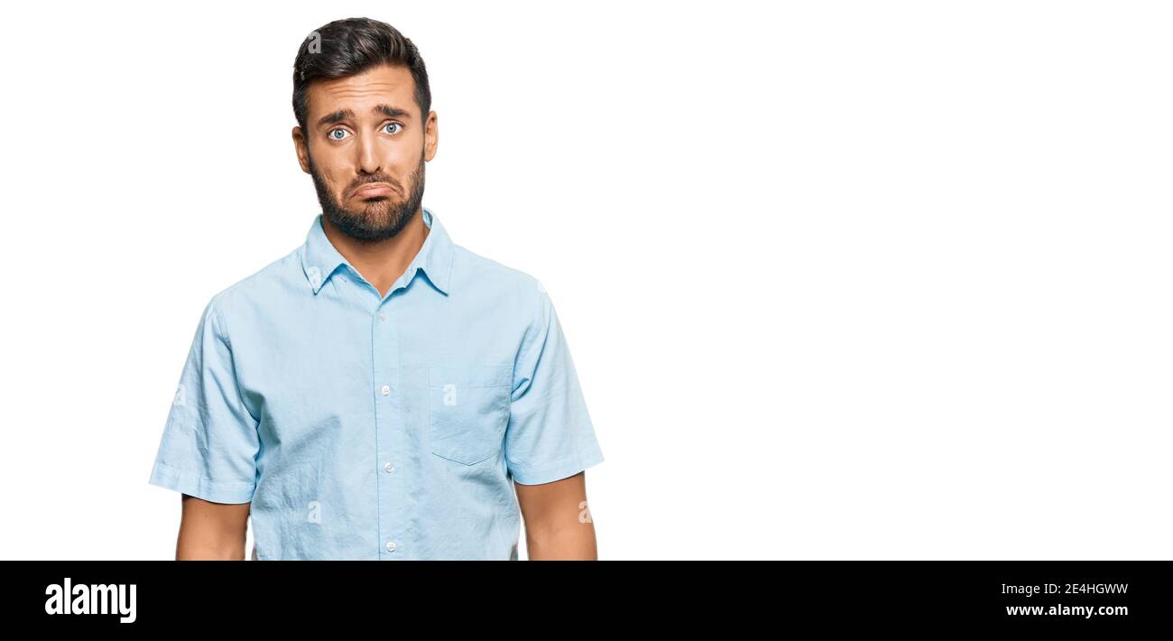 Handsome hispanic man wearing casual clothes depressed and worry for ...