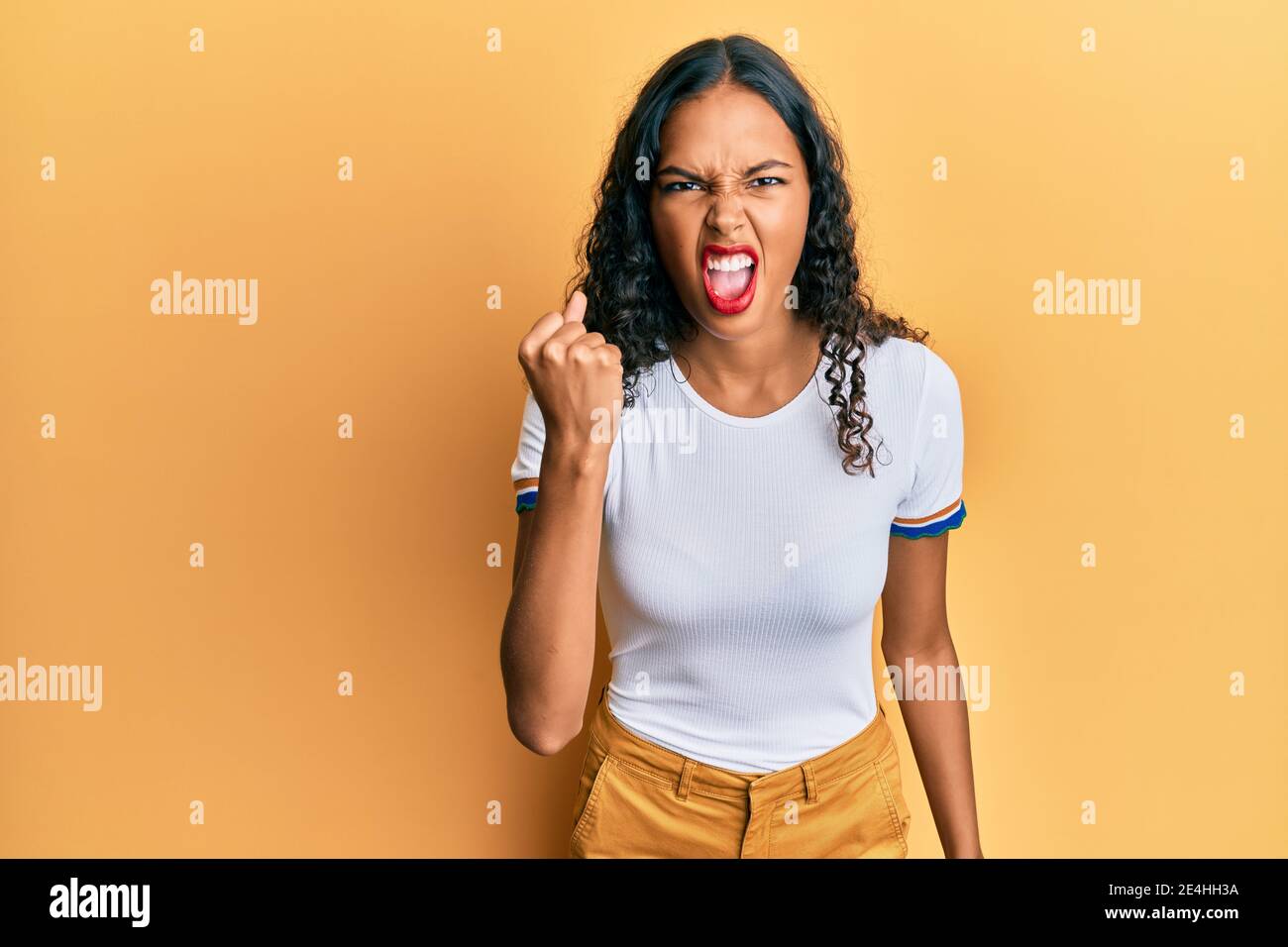 Young african american girl wearing casual clothes angry and mad ...