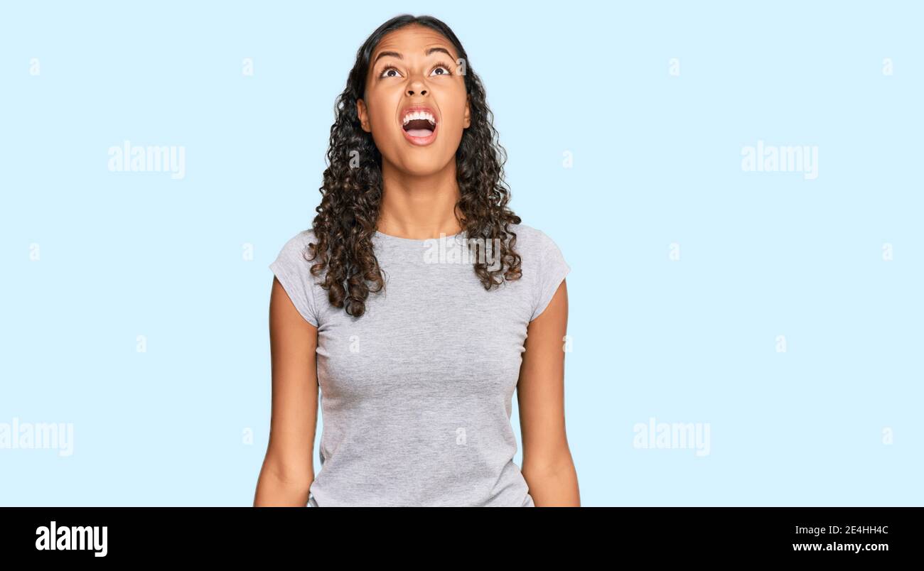 Young african american girl wearing casual clothes angry and mad ...