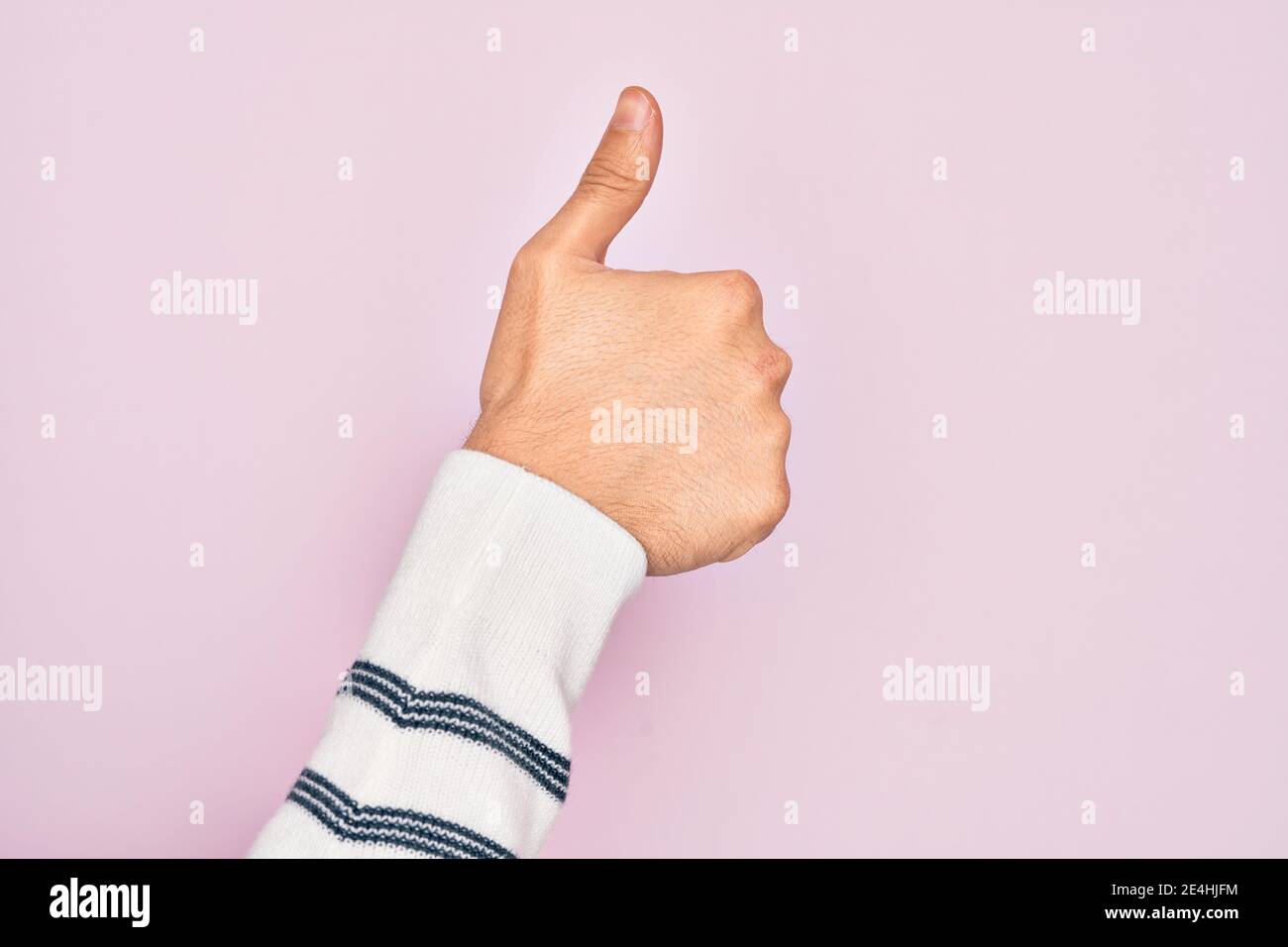 Hand of caucasian young man showing fingers over isolated pink ...