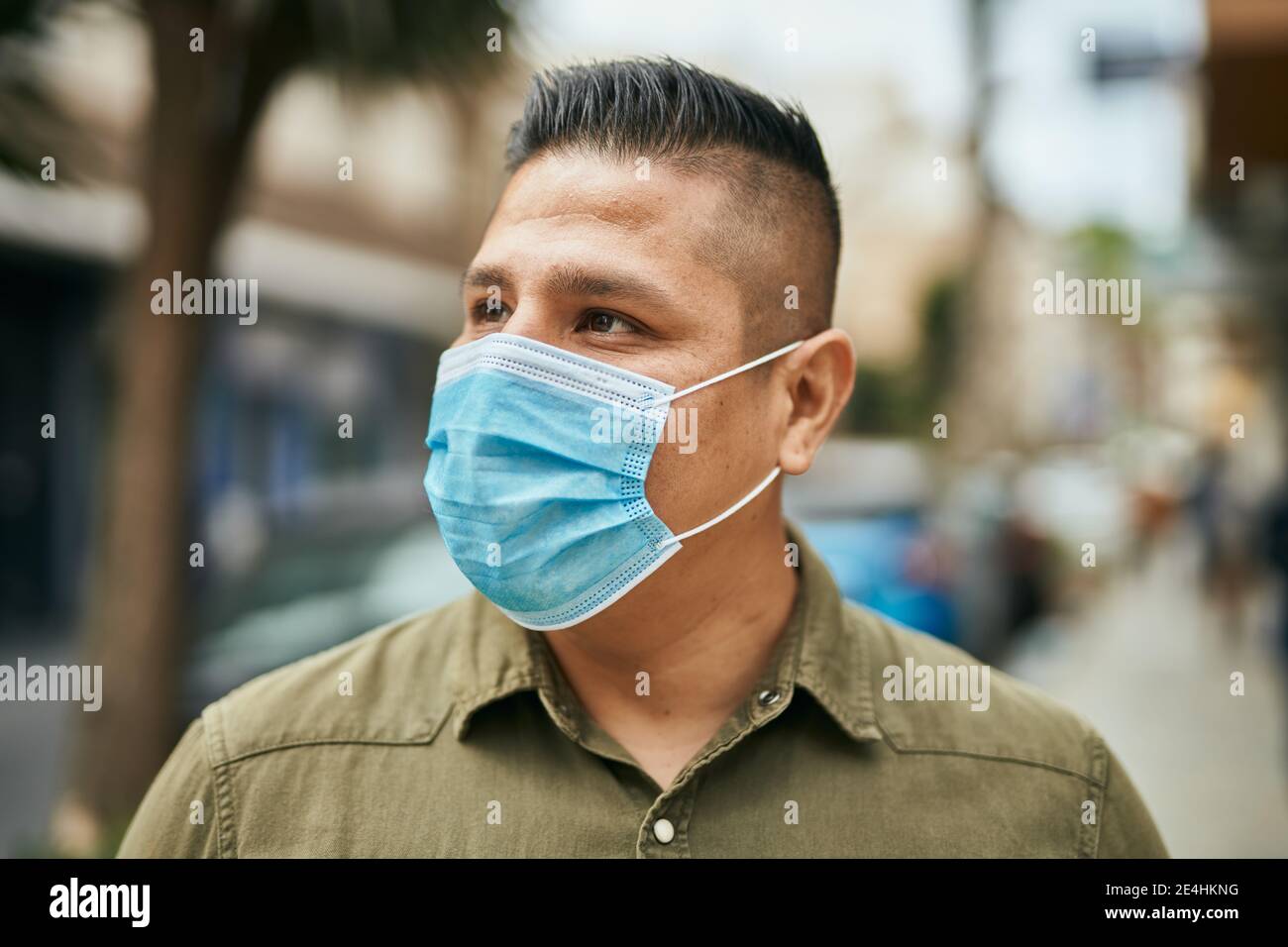 Latin young man mask walking hi-res stock photography and images - Alamy