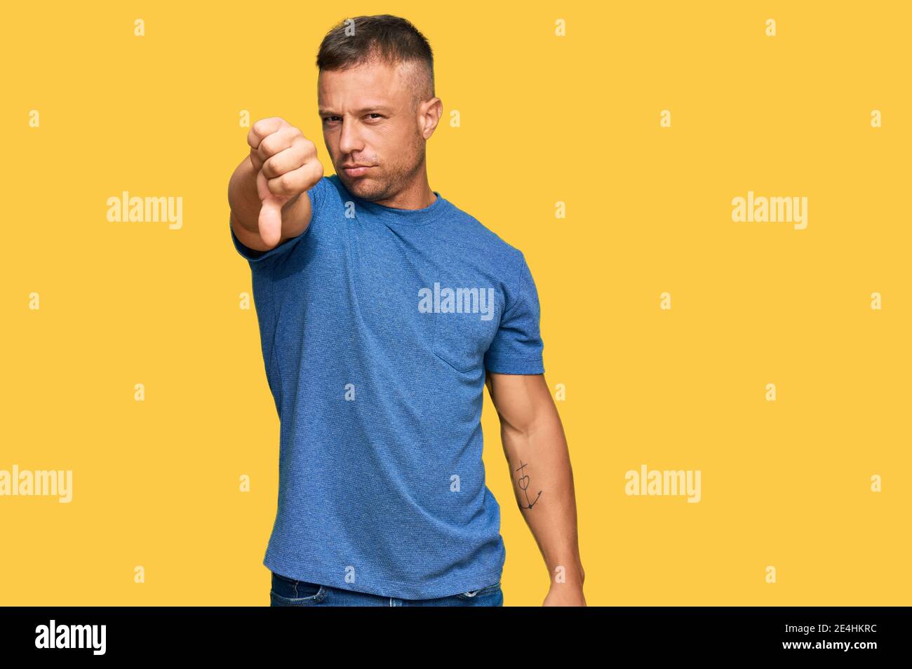 Handsome muscle man wearing casual clothes looking unhappy and angry ...