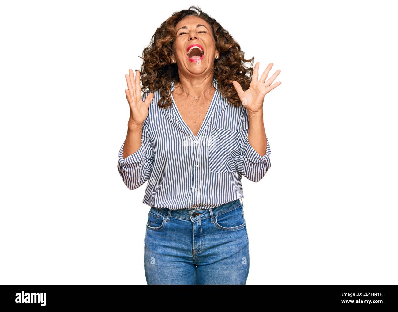 Middle age hispanic woman wearing casual clothes celebrating mad and ...