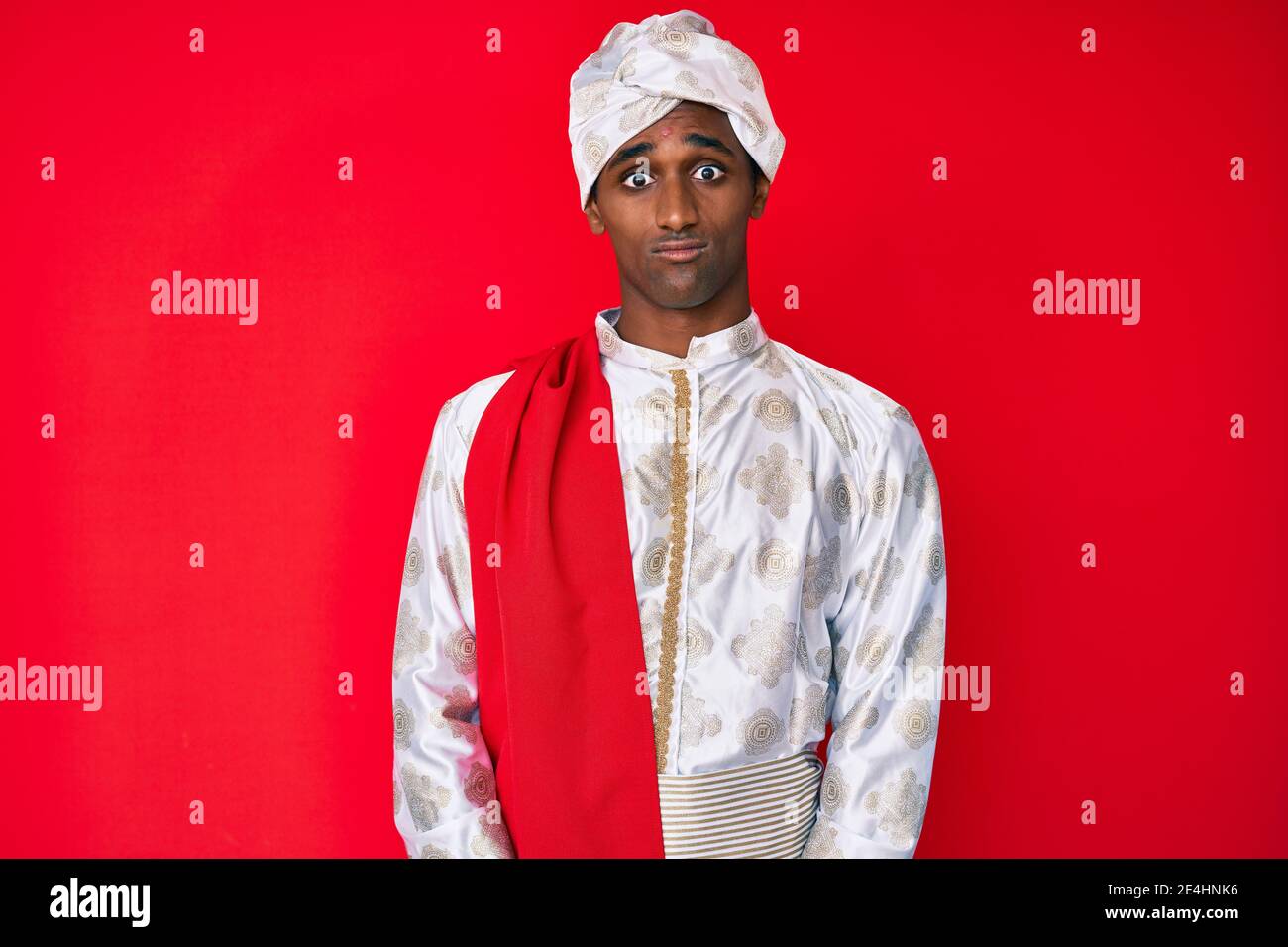 Handsome indian man wearing tradition sherwani saree clothes depressed ...