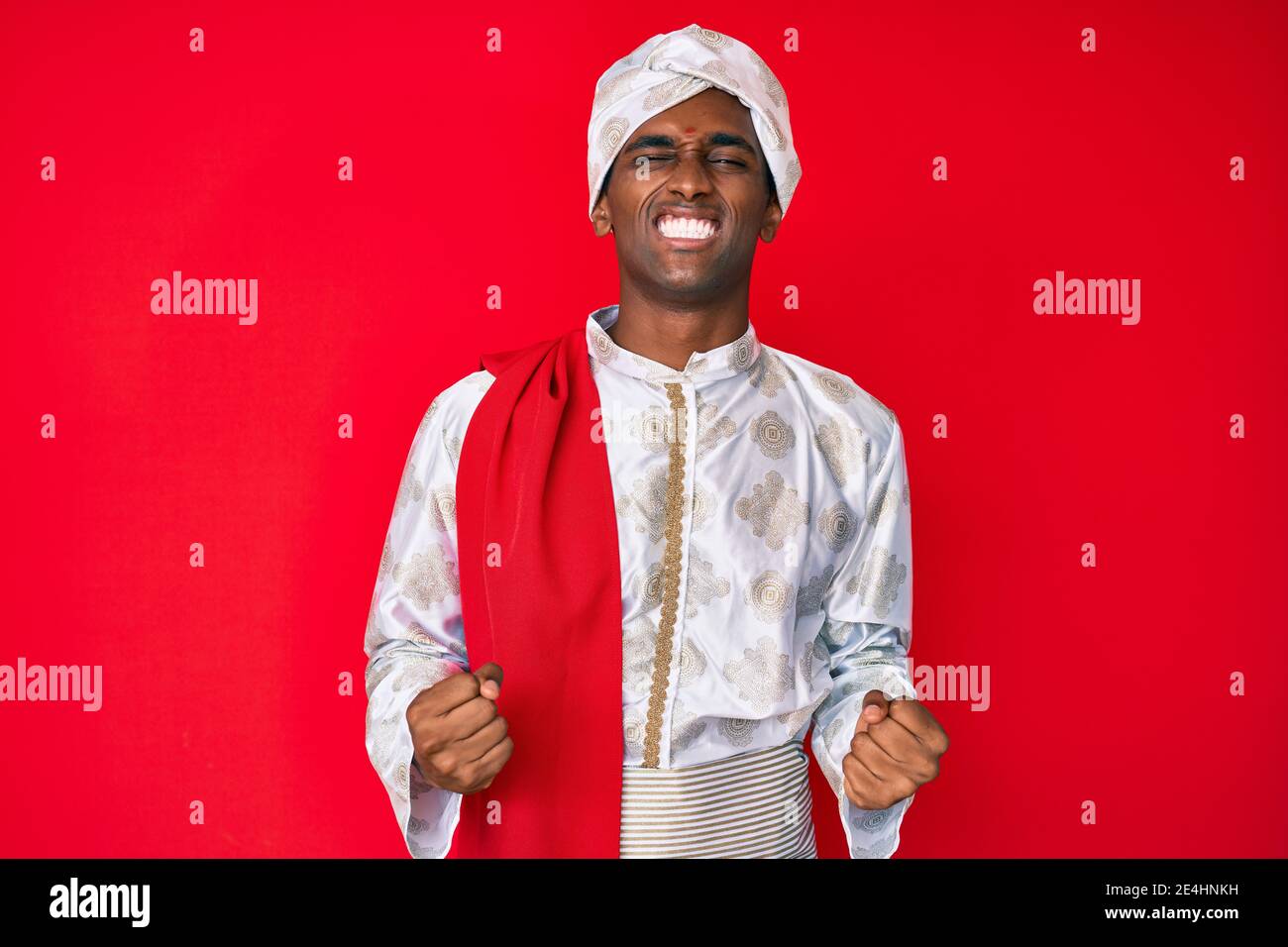 Handsome indian man wearing tradition sherwani saree clothes very happy ...