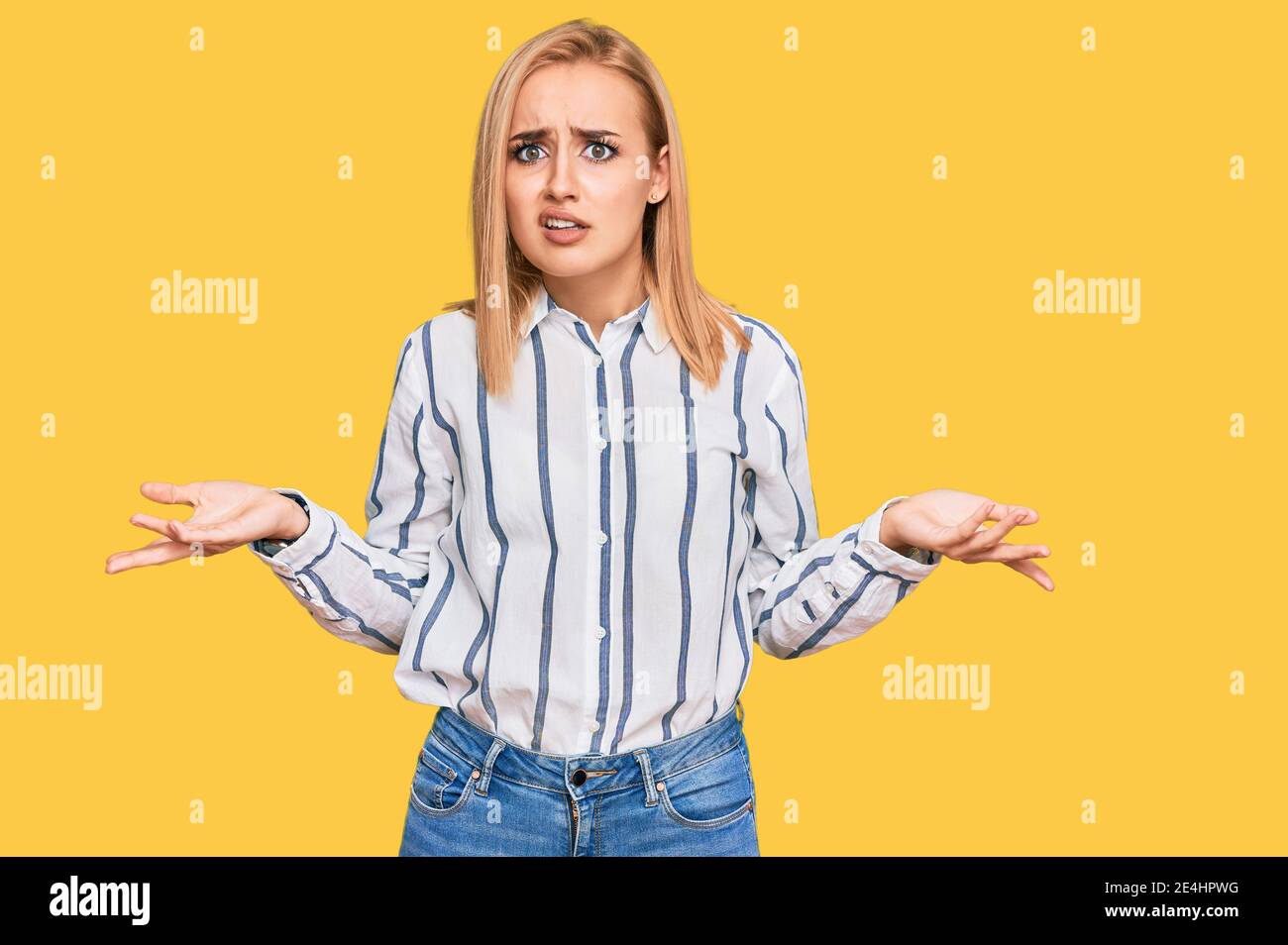 Beautiful caucasian woman wearing casual clothes clueless and confused ...