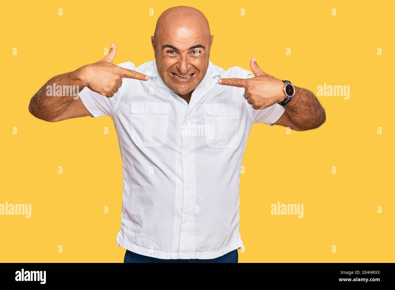 Mature middle east man with mustache wearing casual white shirt smiling ...