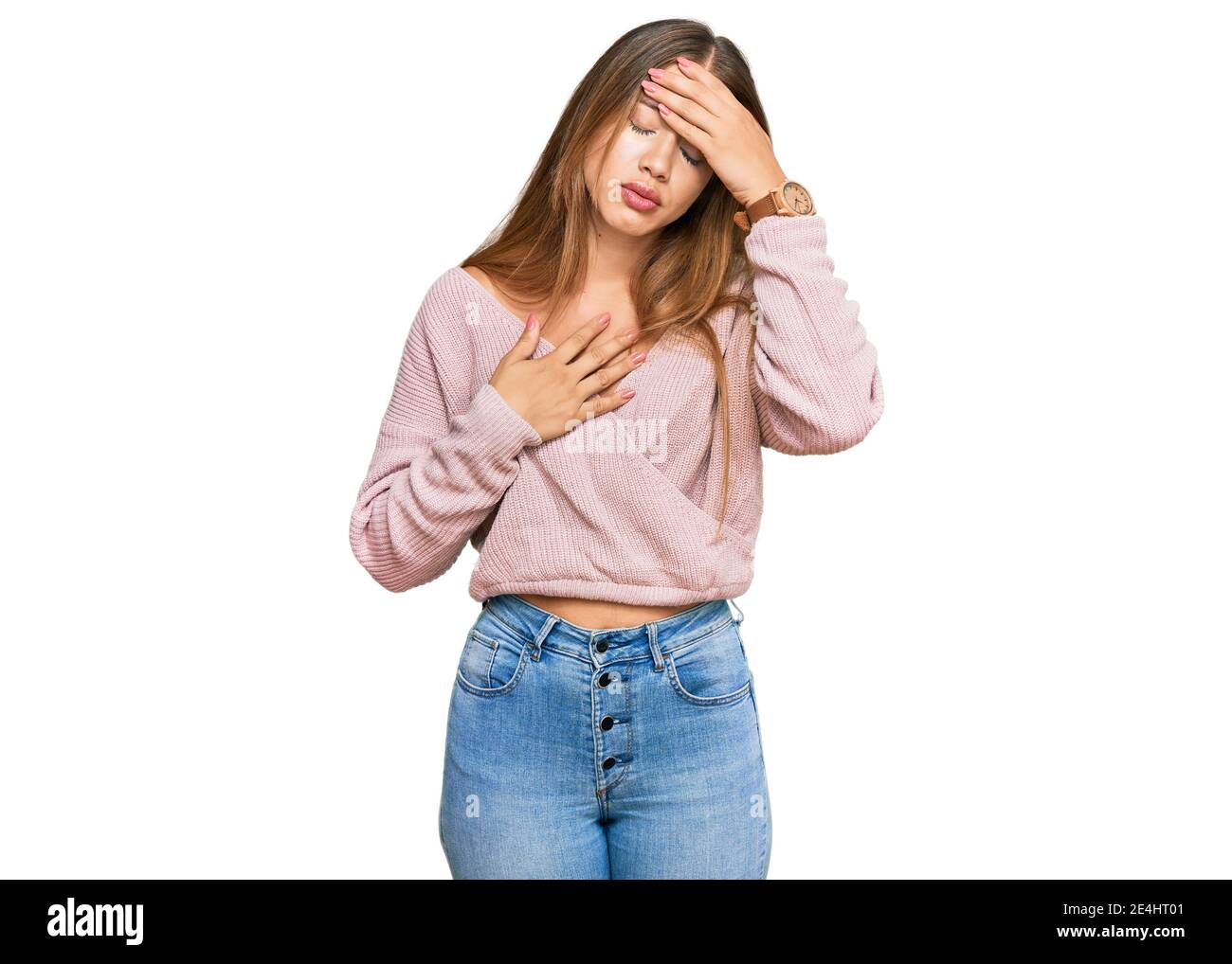 Beautiful blonde woman wearing casual winter pink sweater touching ...