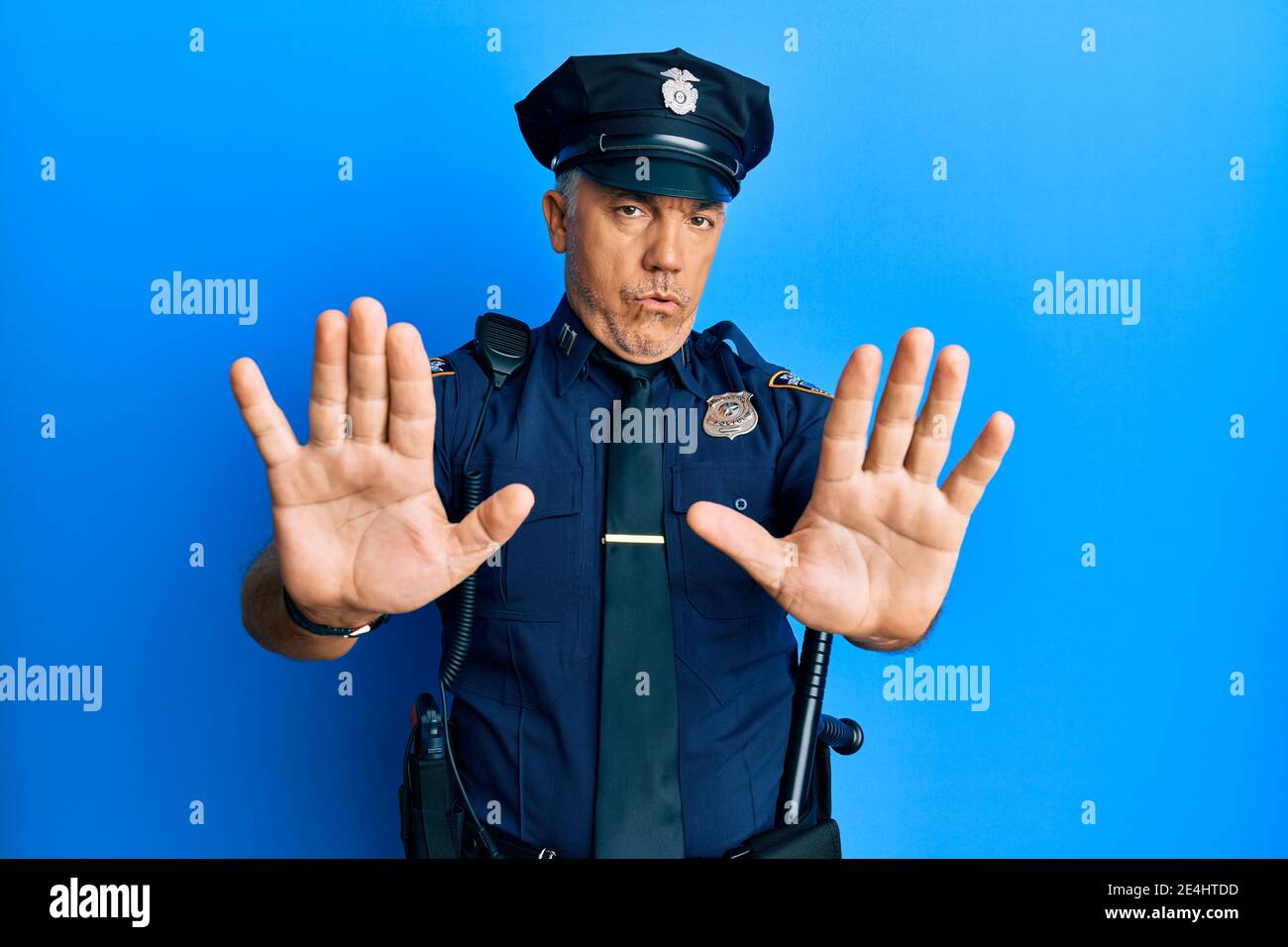 Police pushing man away hi-res stock photography and images - Alamy