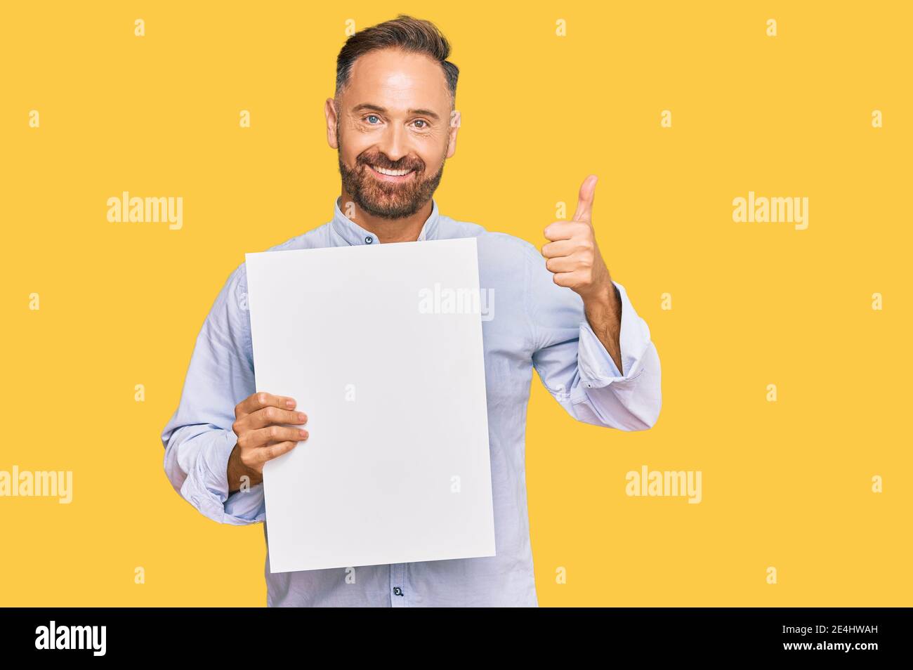 Handsome Middle Age Man Holding Blank Empty Banner Smiling Happy And