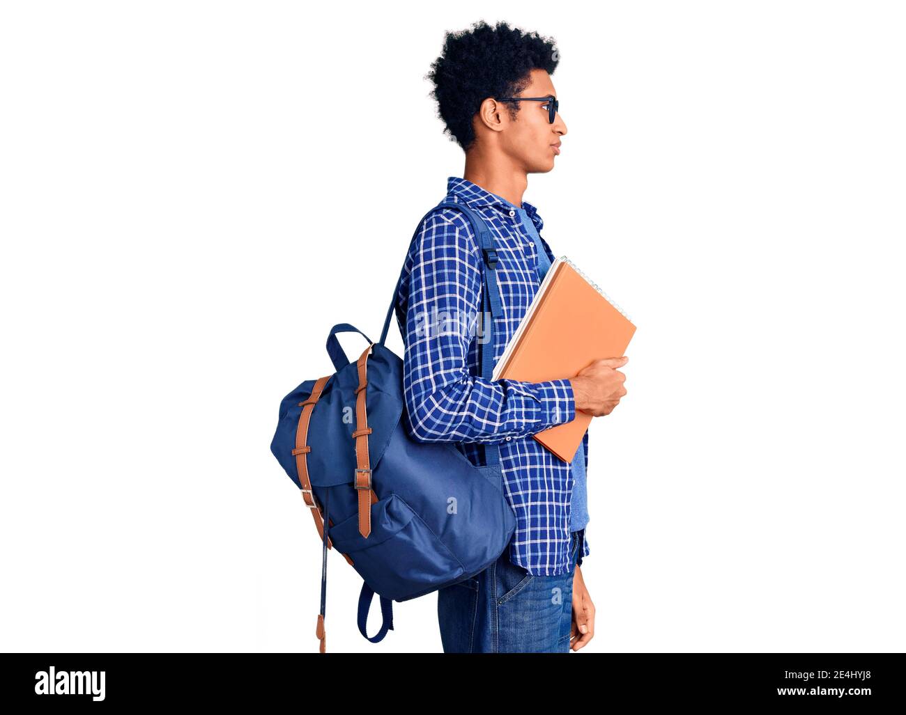 Young african american man wearing student backpack holding book ...