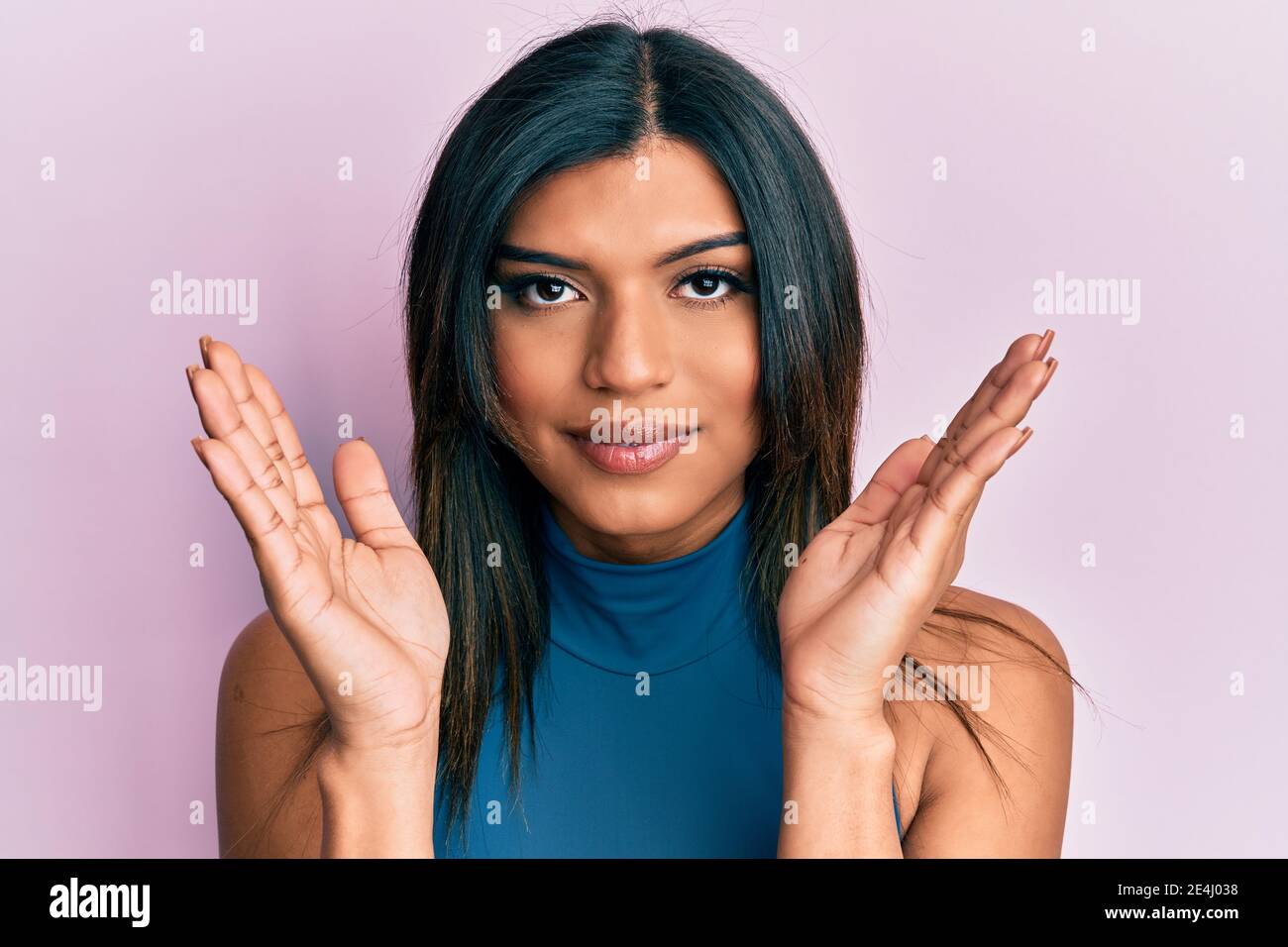 Young latin transsexual transgender woman with hands over face relaxed ...