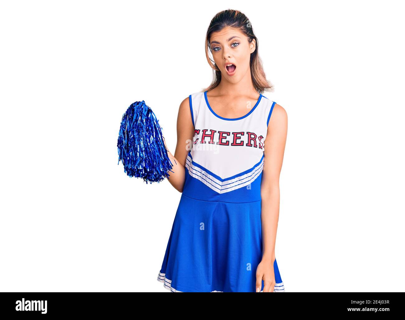 Young Beautiful Woman Wearing Cheerleader Uniform In Shock Face