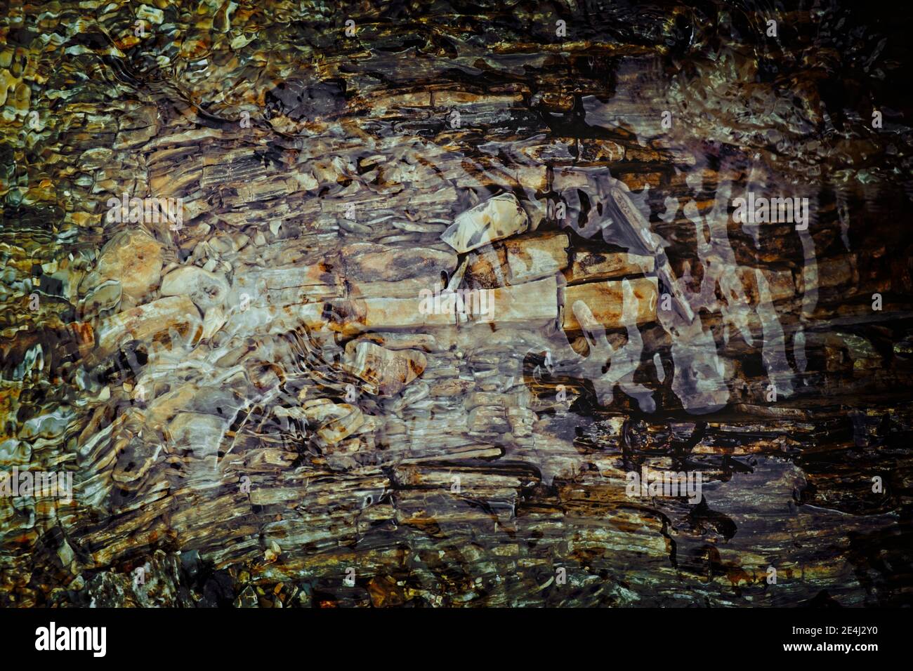 Top view of the eroded stone bed of a creek consisting of brown shale ...