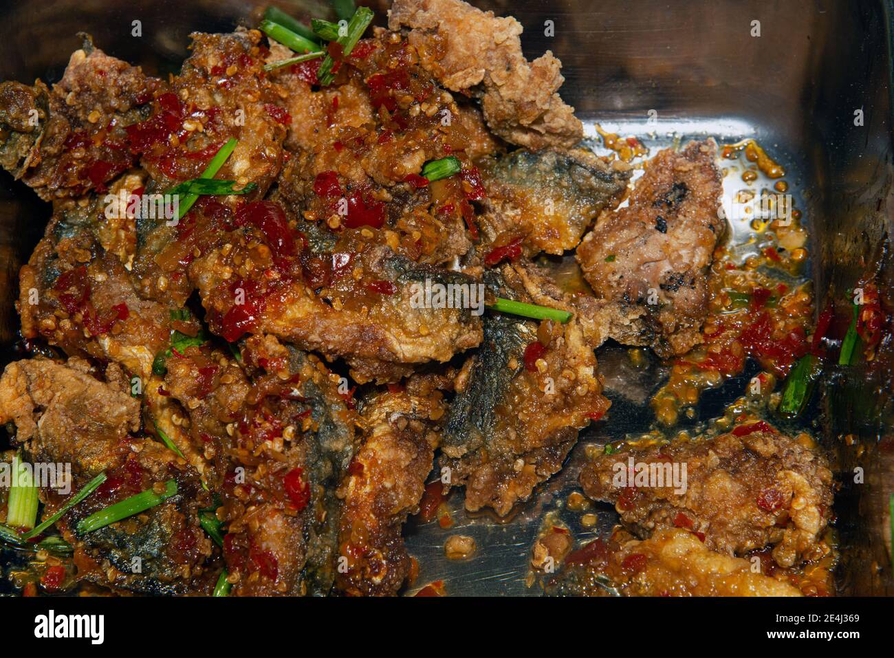 Outdoor food stalls selling dried fish with chili and scallions Stock ...