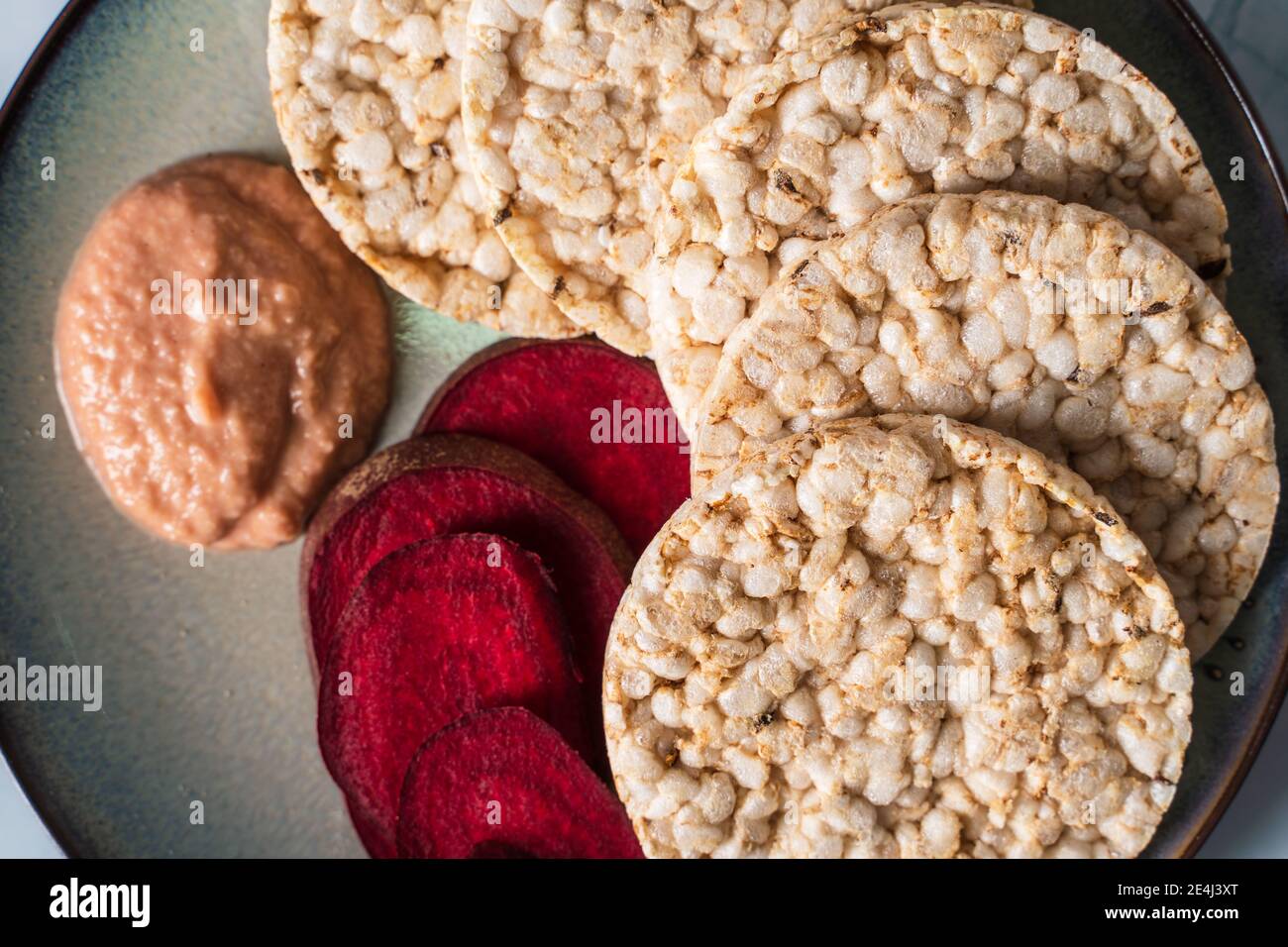 Crispy puffed rice cakes on plate - top view on healthy vegetarian or ...