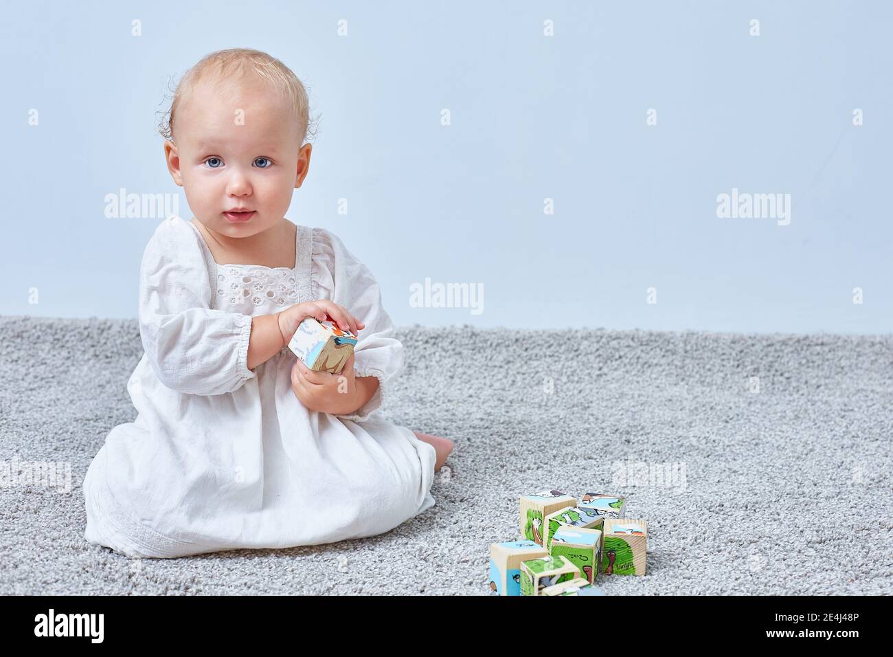Happy children playing cubes hi-res stock photography and images - Alamy