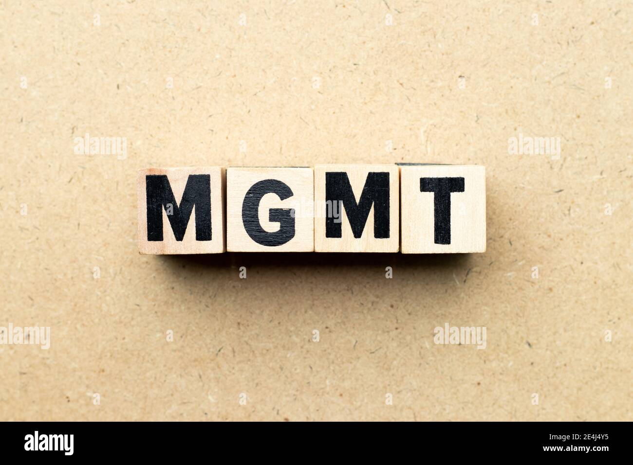 Alphabet letter block in word mgmt (abbreviation of Management) on wood ...