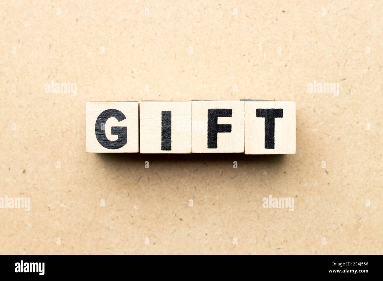 Alphabet letter block in word gift on wood background Stock Photo - Alamy