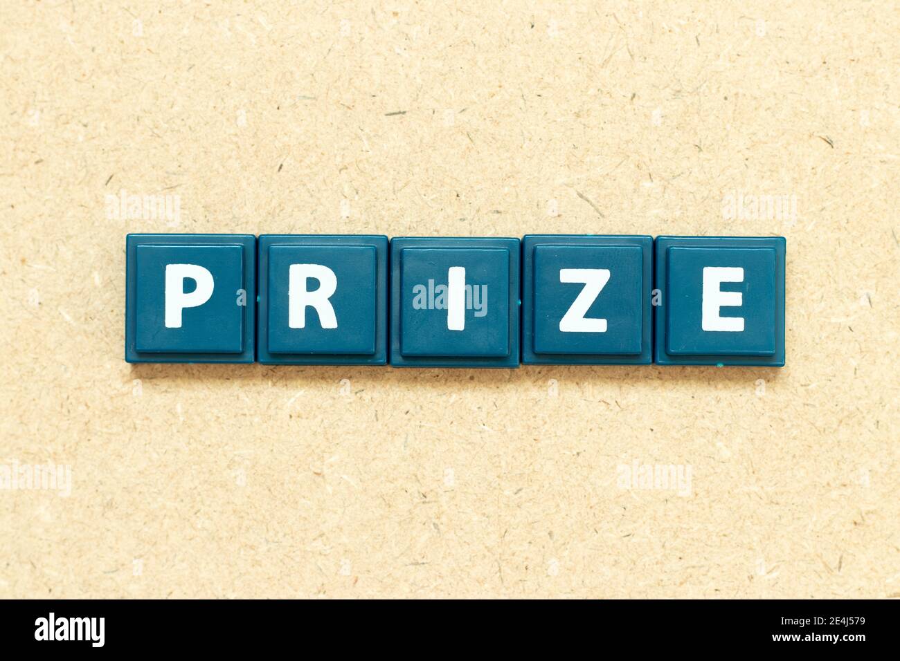 Tile alphabet letter in word prize on wood background Stock Photo - Alamy