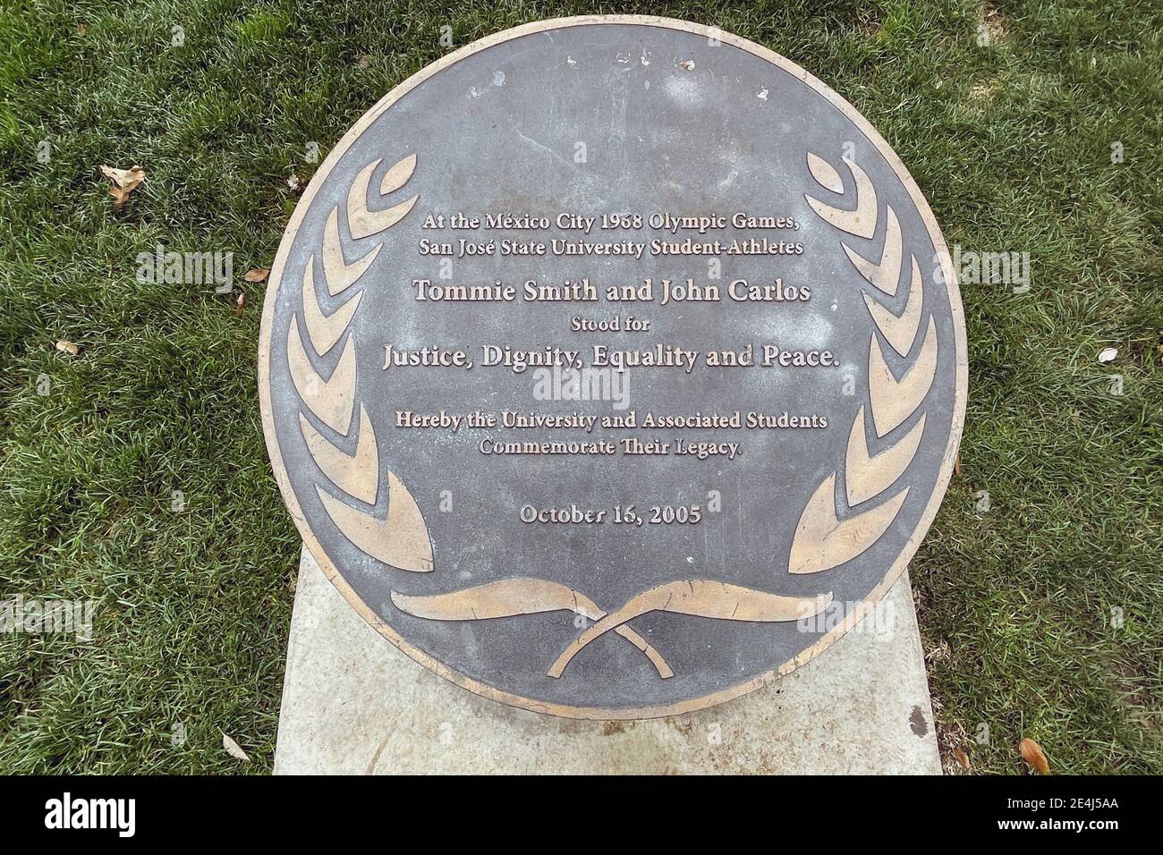 A plaque at the Victory Salute statue at San Jose State University ...