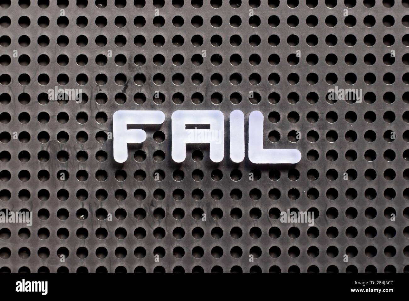 White color letter in word fail on black pegboard background Stock ...