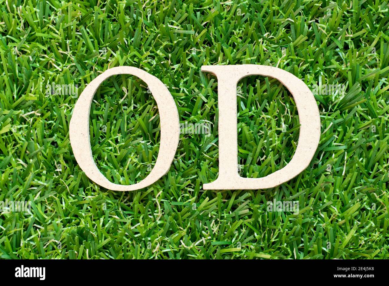 Alphabet letter in word OD (Abbreviation of overdraft) on green grass ...