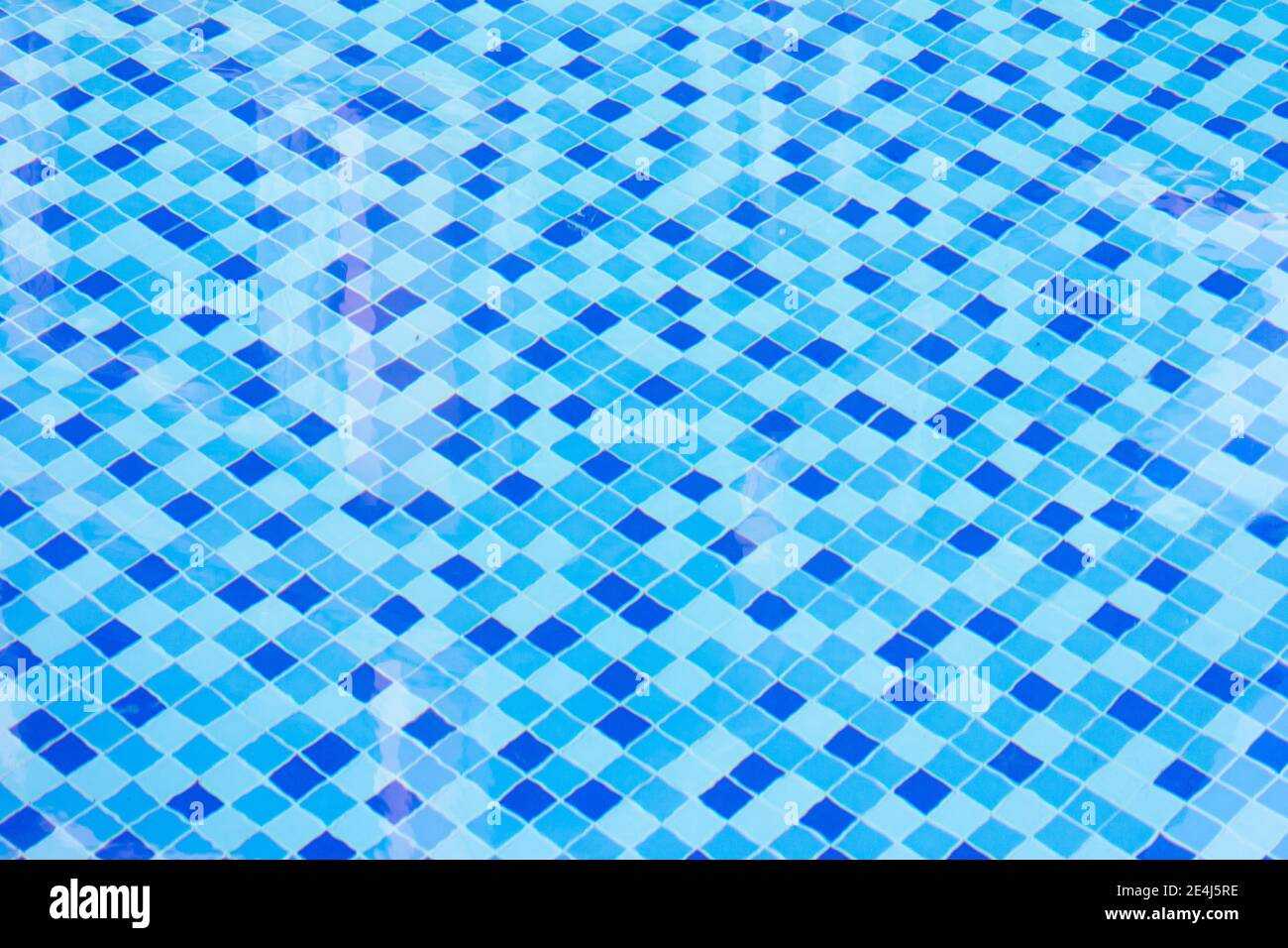 Ripple Water in swimming pool with blue tile floor background Stock ...