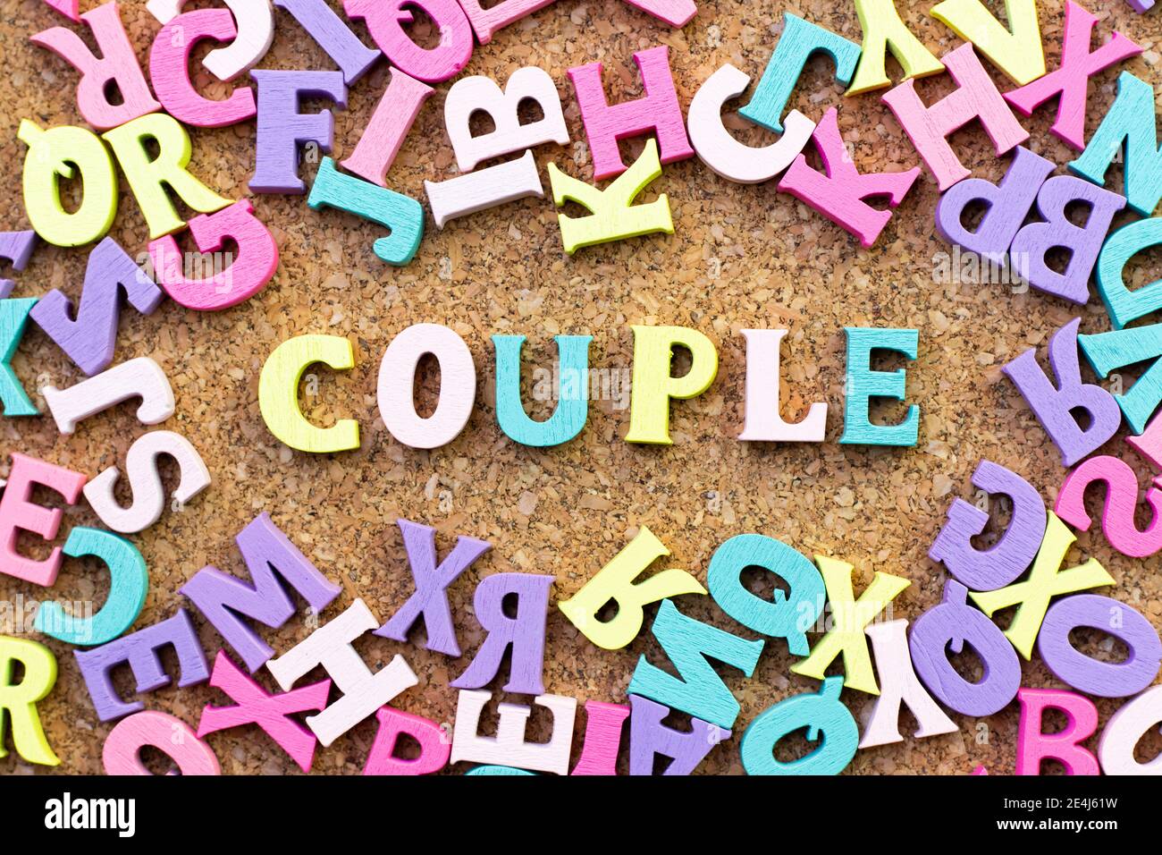 Color alphabet in word couple with another letter as frame on cork ...