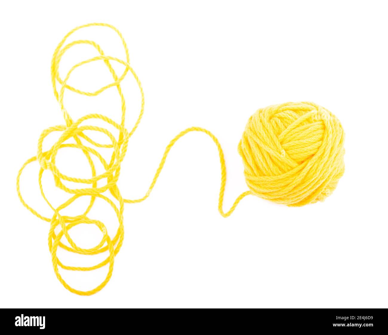 The idea is a tangled thread. Yellow ball of yarn on white background ...