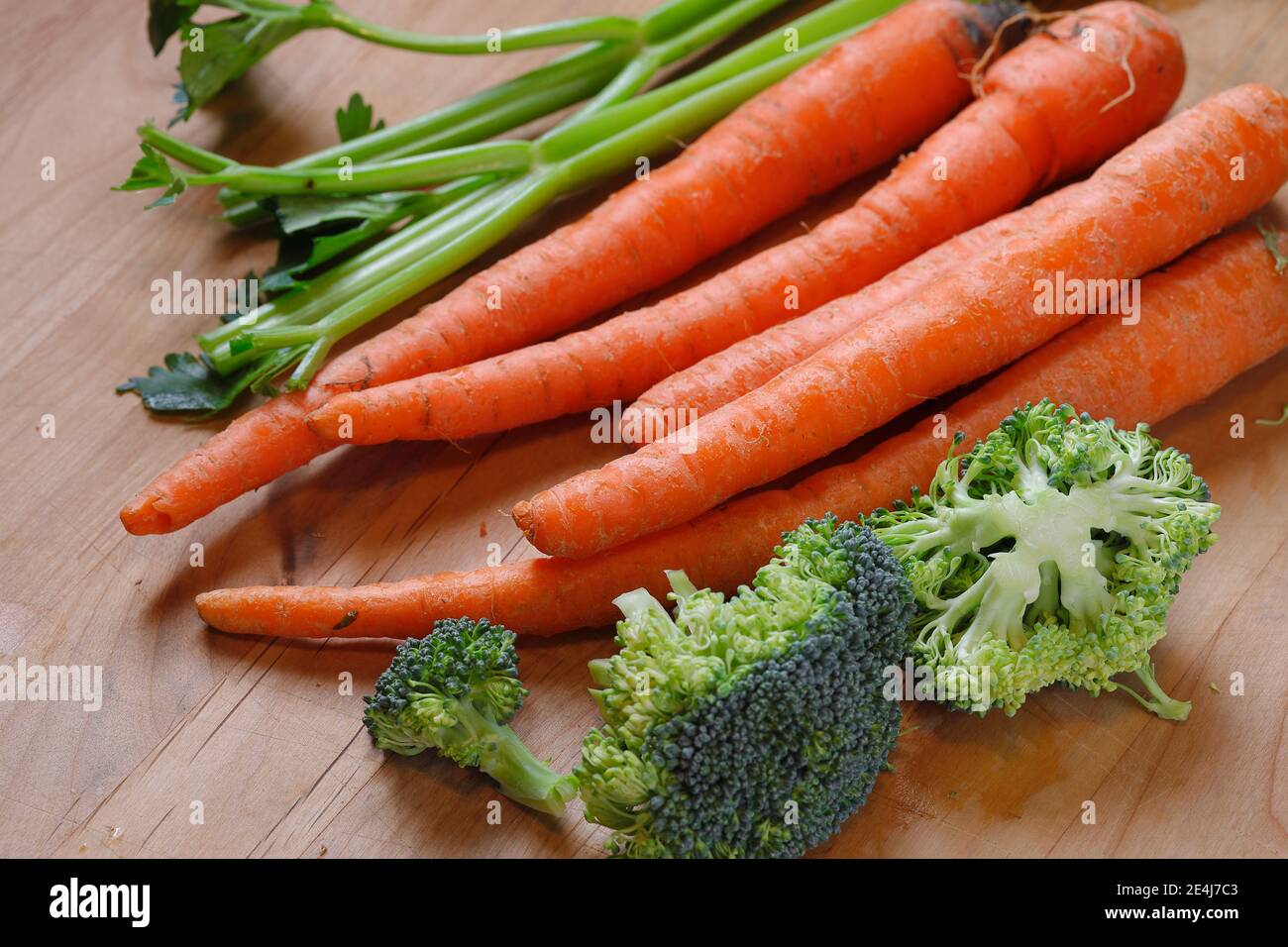 A close up photo of carrots, celery stalks, and some broccoli Stock ...