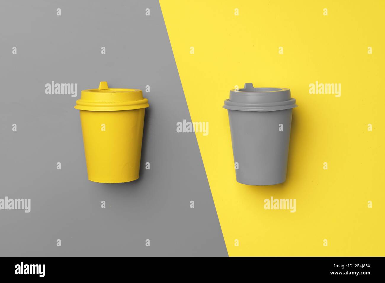 Disposable coffee cup in yellow gray colors Stock Photo - Alamy