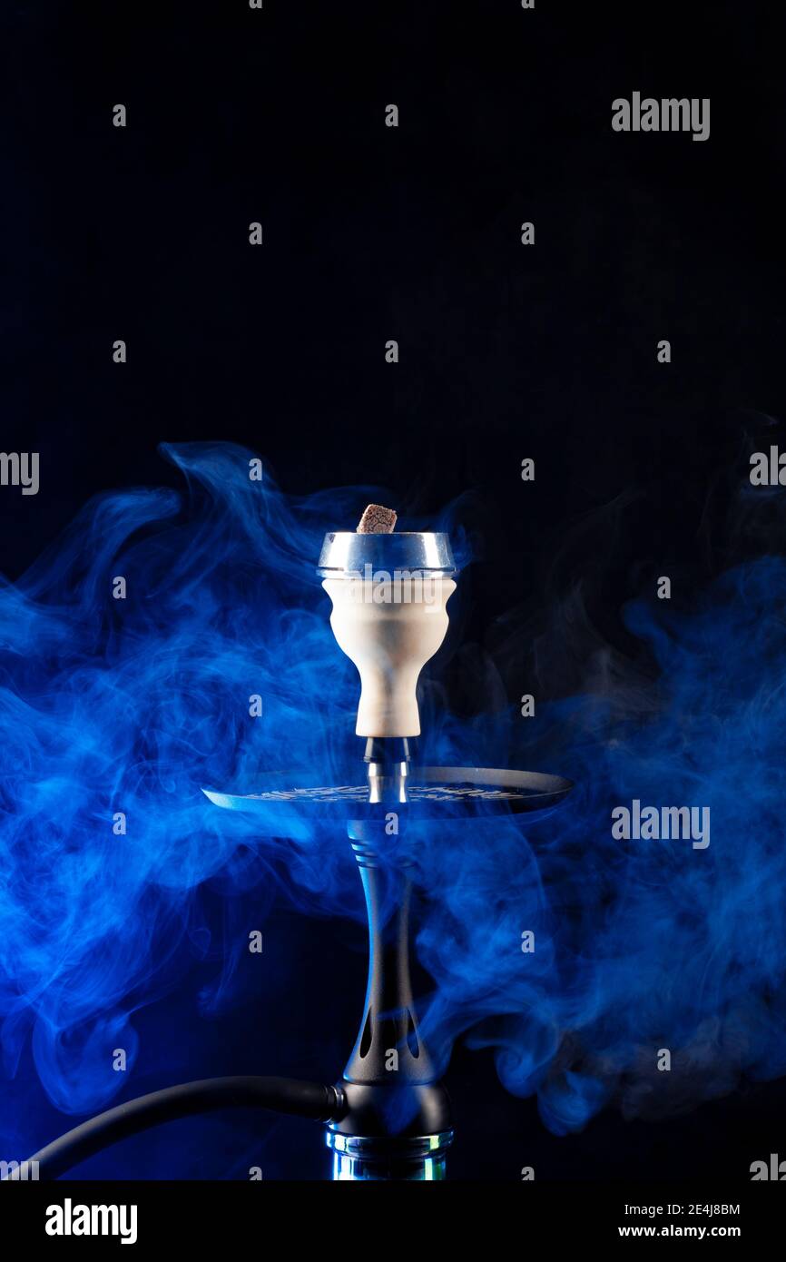 Shisha hookah with hot coals on black background Stock Photo - Alamy