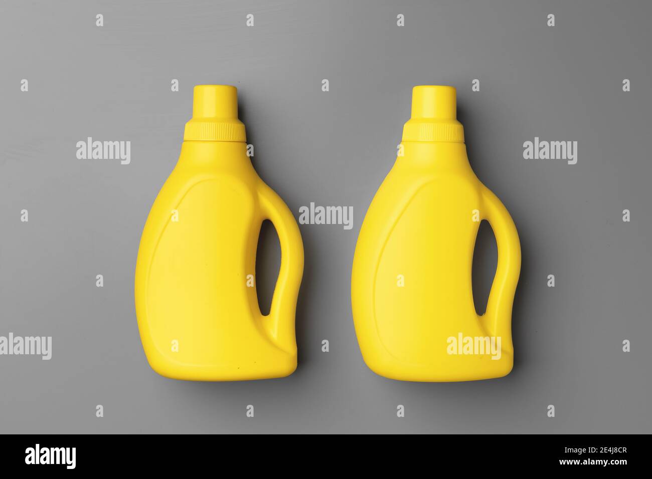 Yellow liquid detergents containers on gray background Stock Photo - Alamy